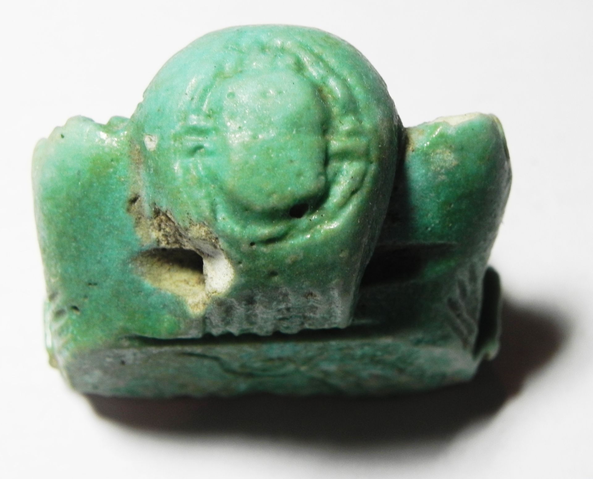 ANCIENT EGYPT, FAIENCE FRAGMENT OF A LARGE PATAIKOS AMULET. 600 B.C