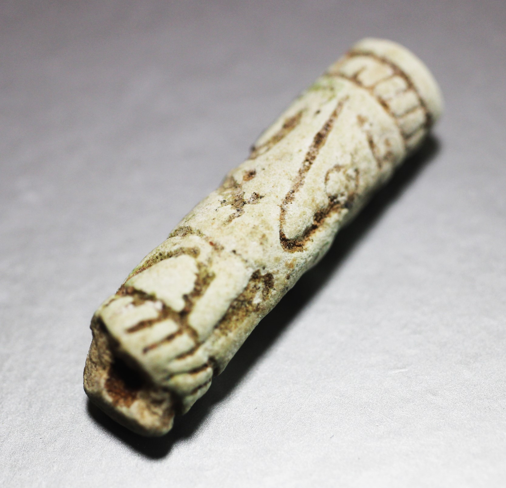 LATE BRONZE AGE. 1400 - 1200 B.C. FAIENCE CYLINDER SEAL.