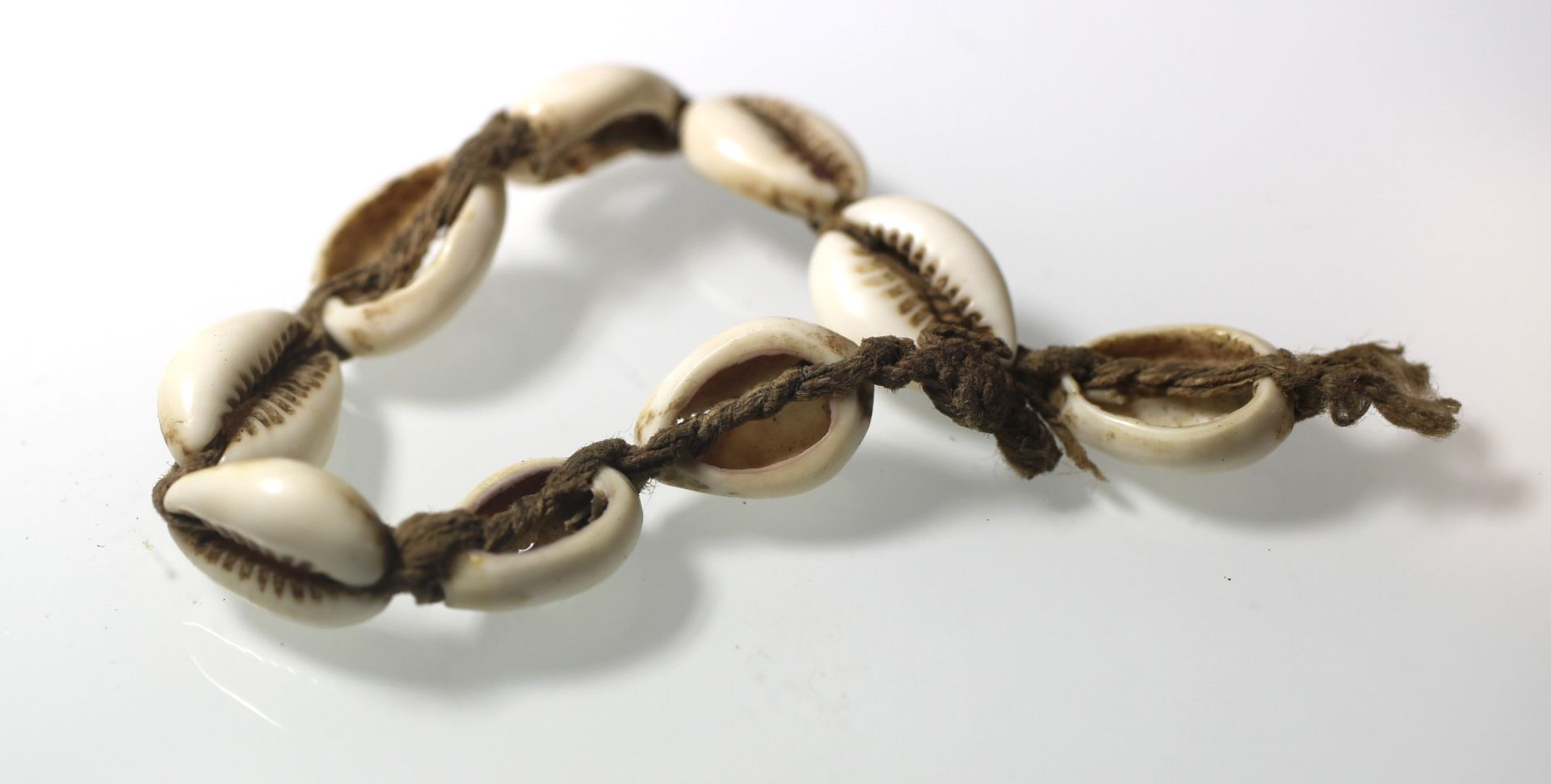 ANCIENT EGYPT. COWRIE SHELLS BEADS WITH ORIGINAL ANCIENT STRING STILL ...